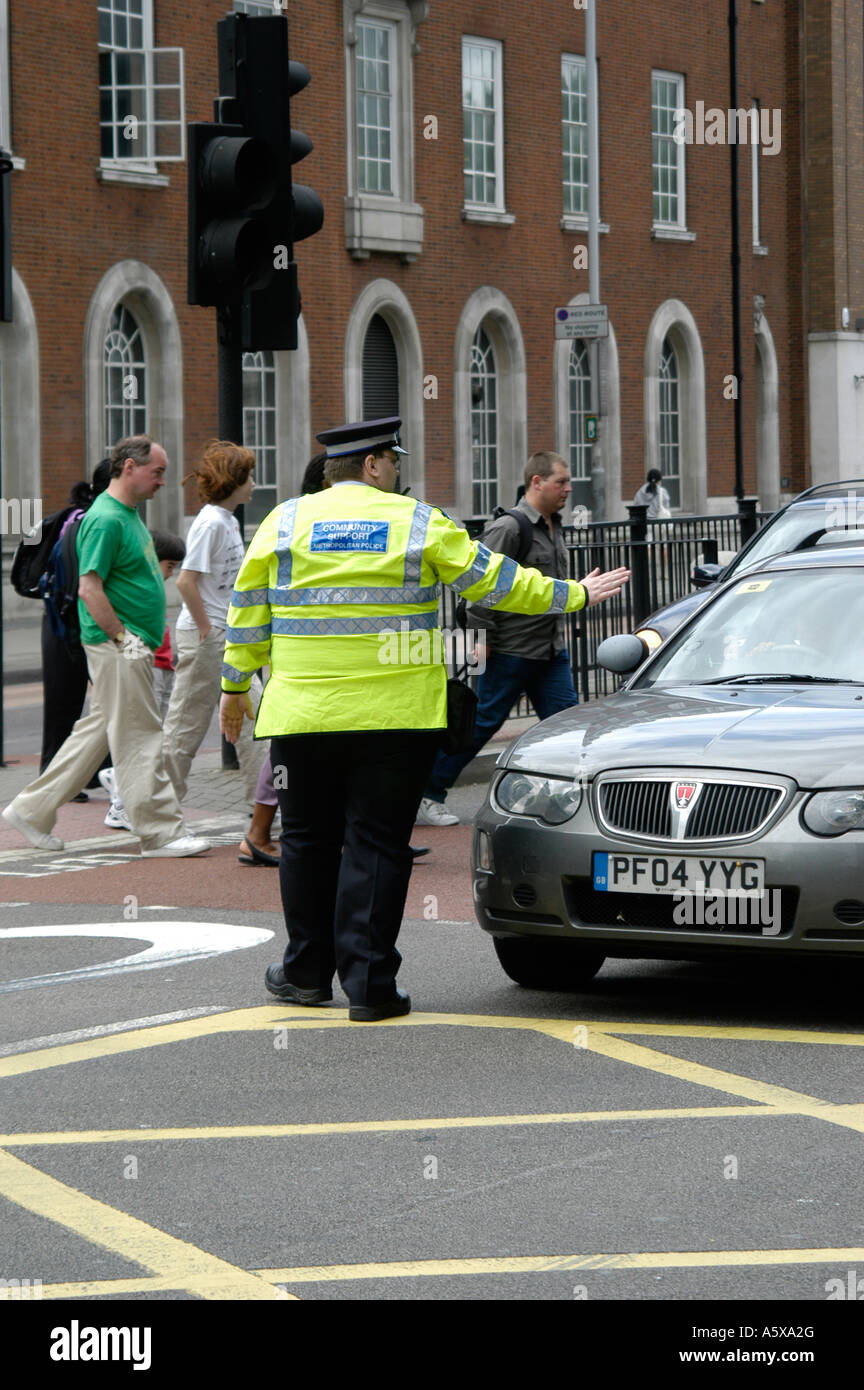 Police car and police officer stopping traffic hi-res stock photography ...