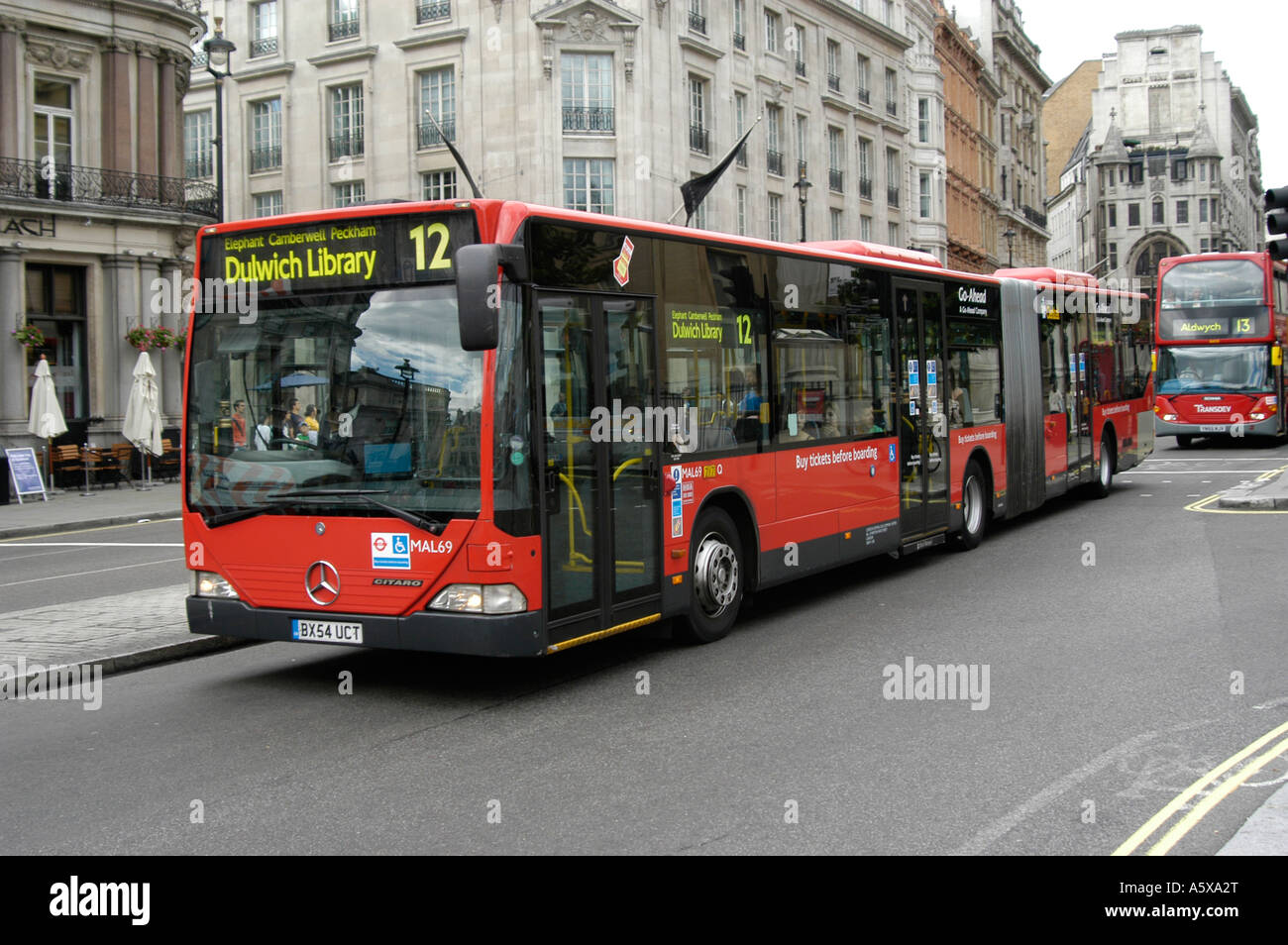 Bendy bus Mercedes Citaro driving through the city of London, England ...