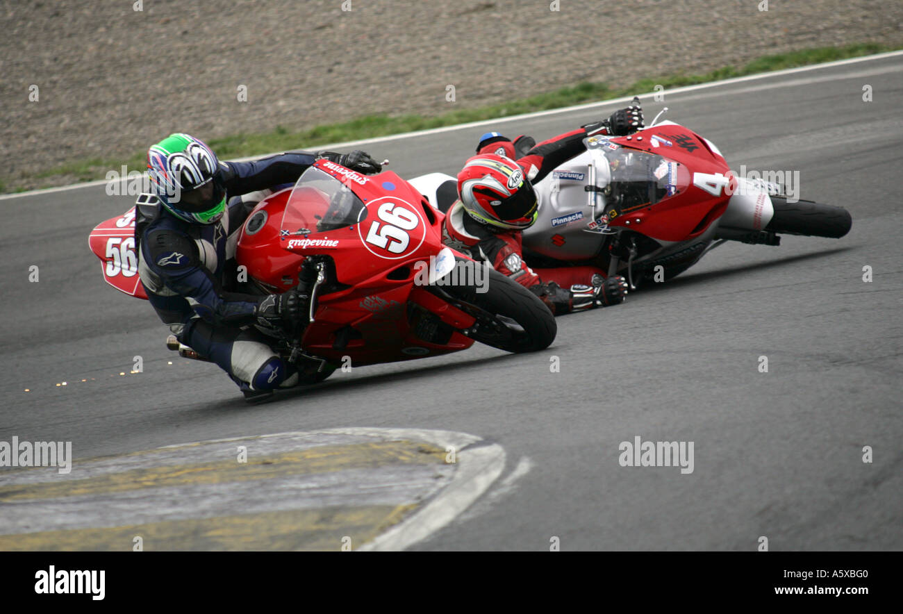Motorcycle racer washes out whilst attempting overtaking Stock Photo ...