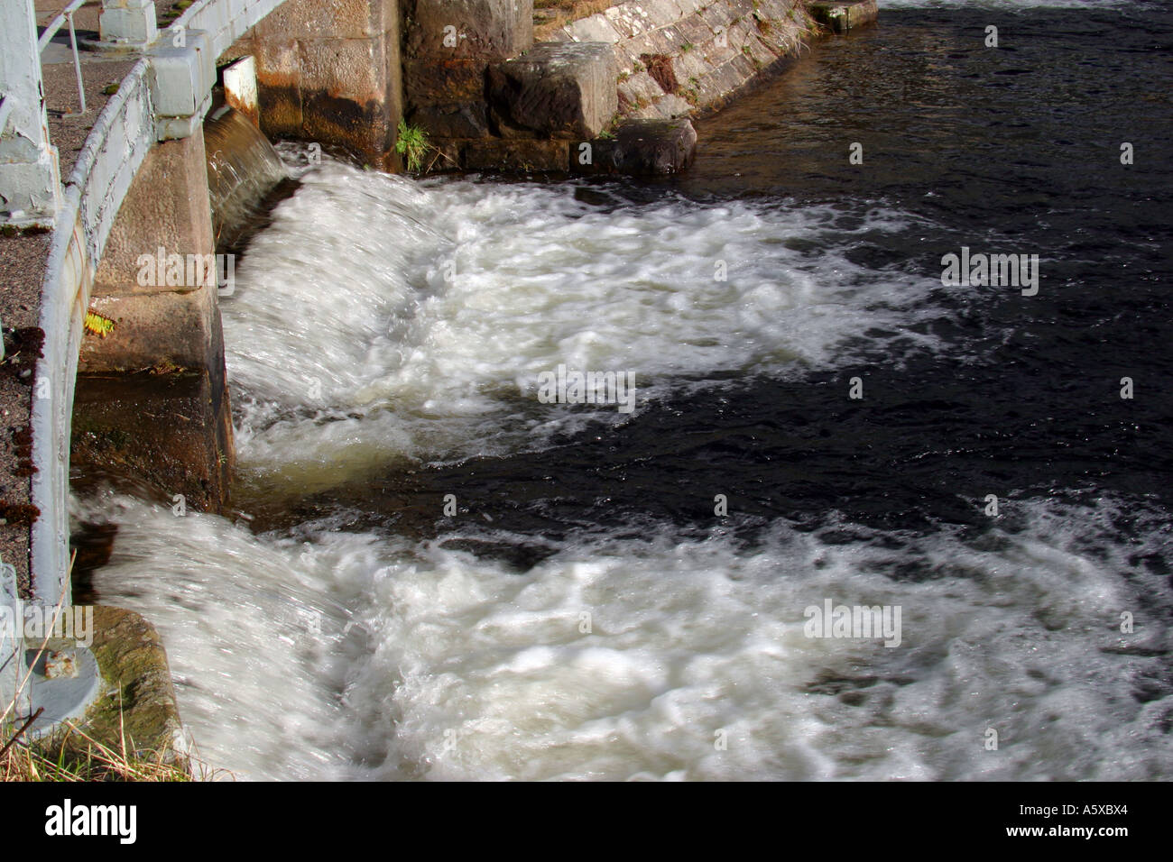 Water running through culvert into reservoir Stock Photo - Alamy