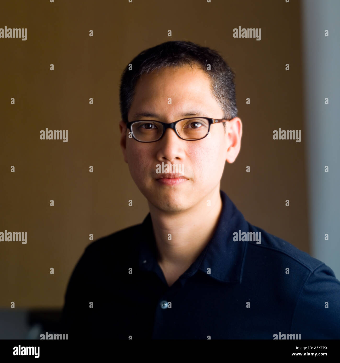 Asian man Looking at Camera Stock Photo - Alamy