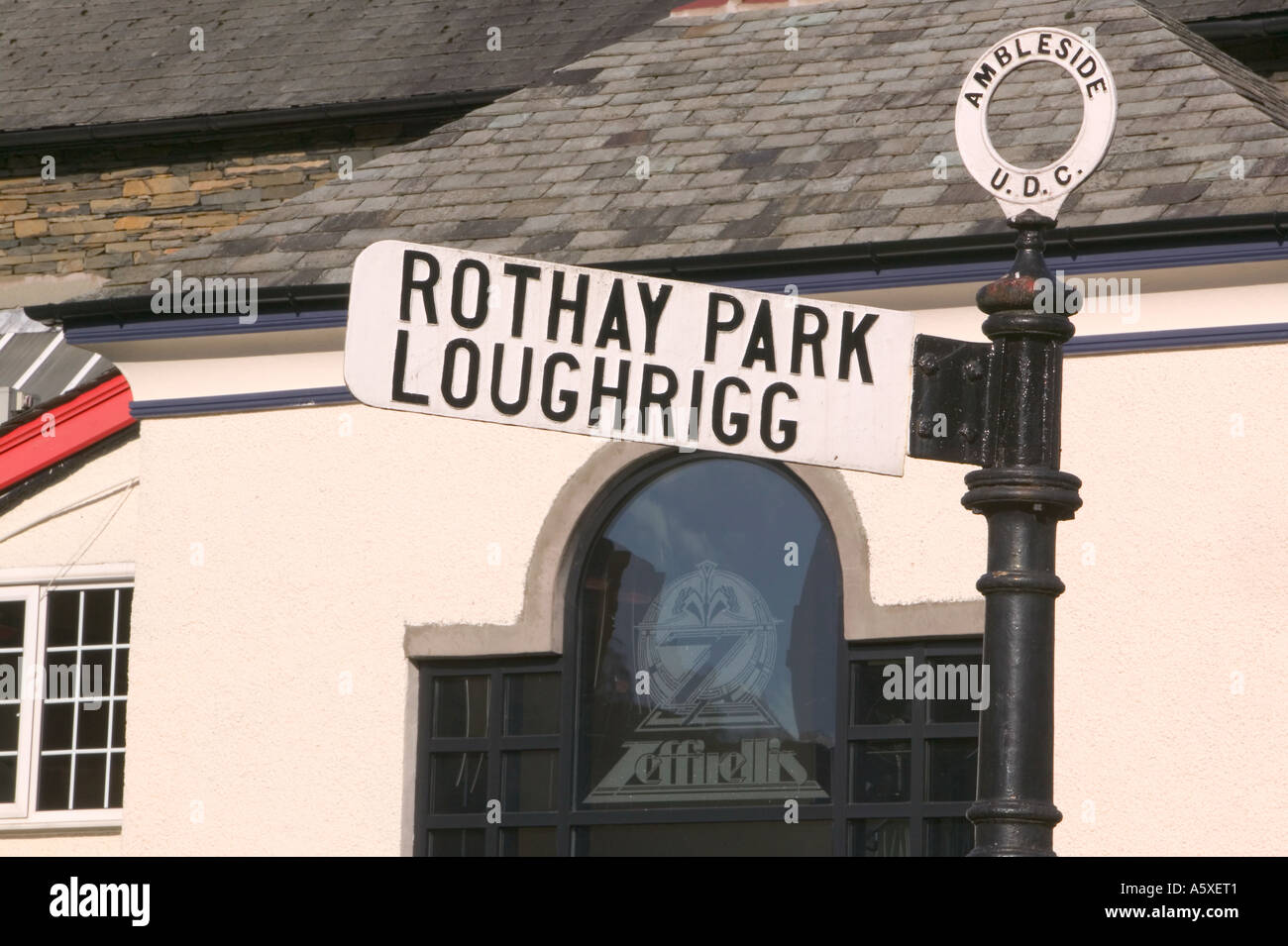 an old road sign in Ambleside, Cumbria, UK, outside Zeffirellis cinema ...