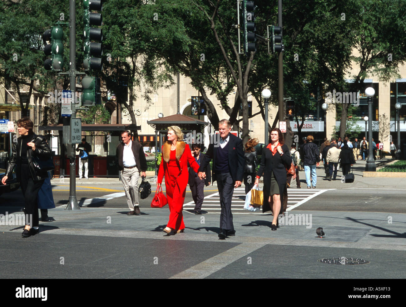 STREET SCENE Chicago Illinois Couple hold hands in crosswalk corner ...
