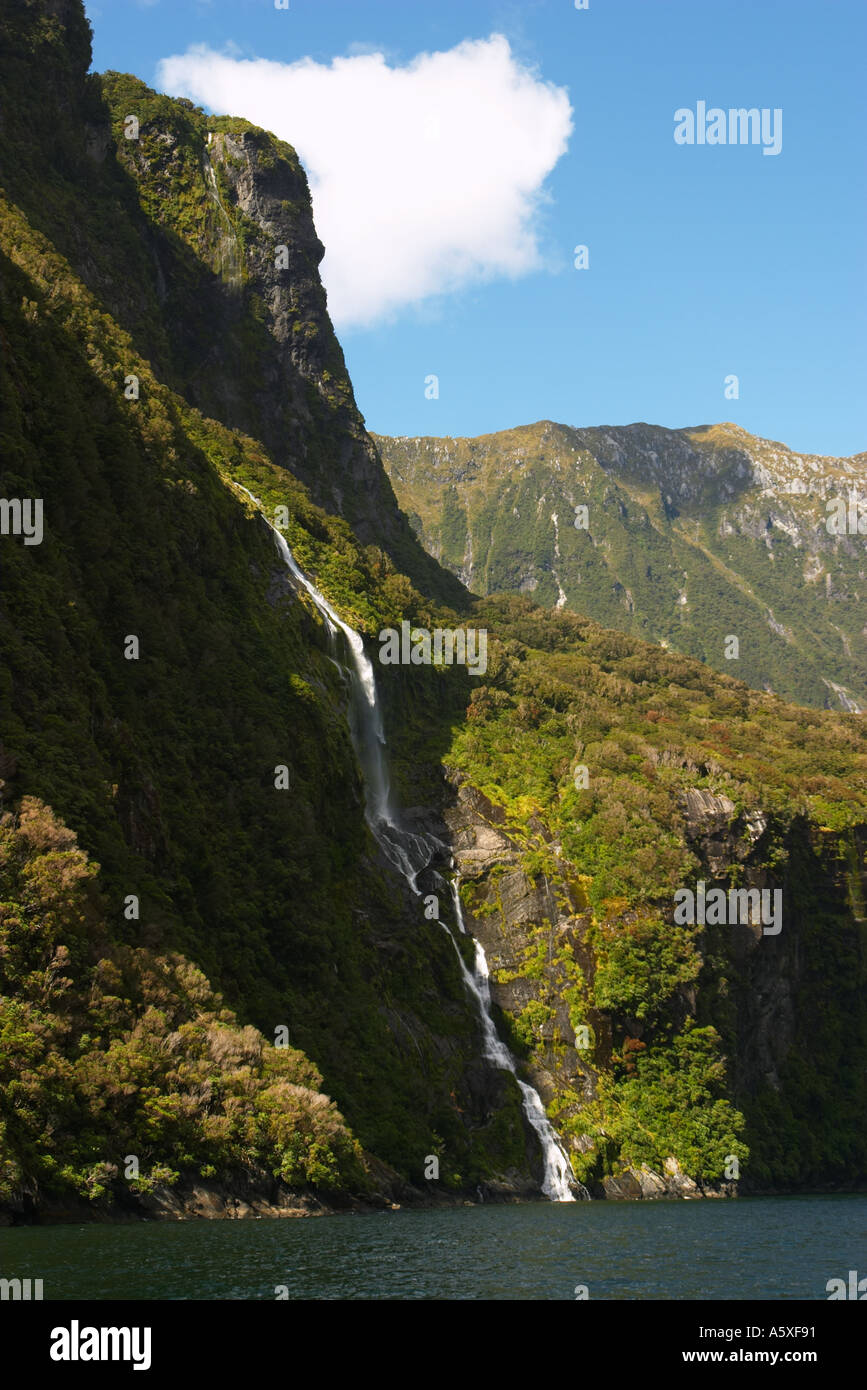NEW ZEALAND Milford Sound Waterfall cascades in Fiordland National Park ...