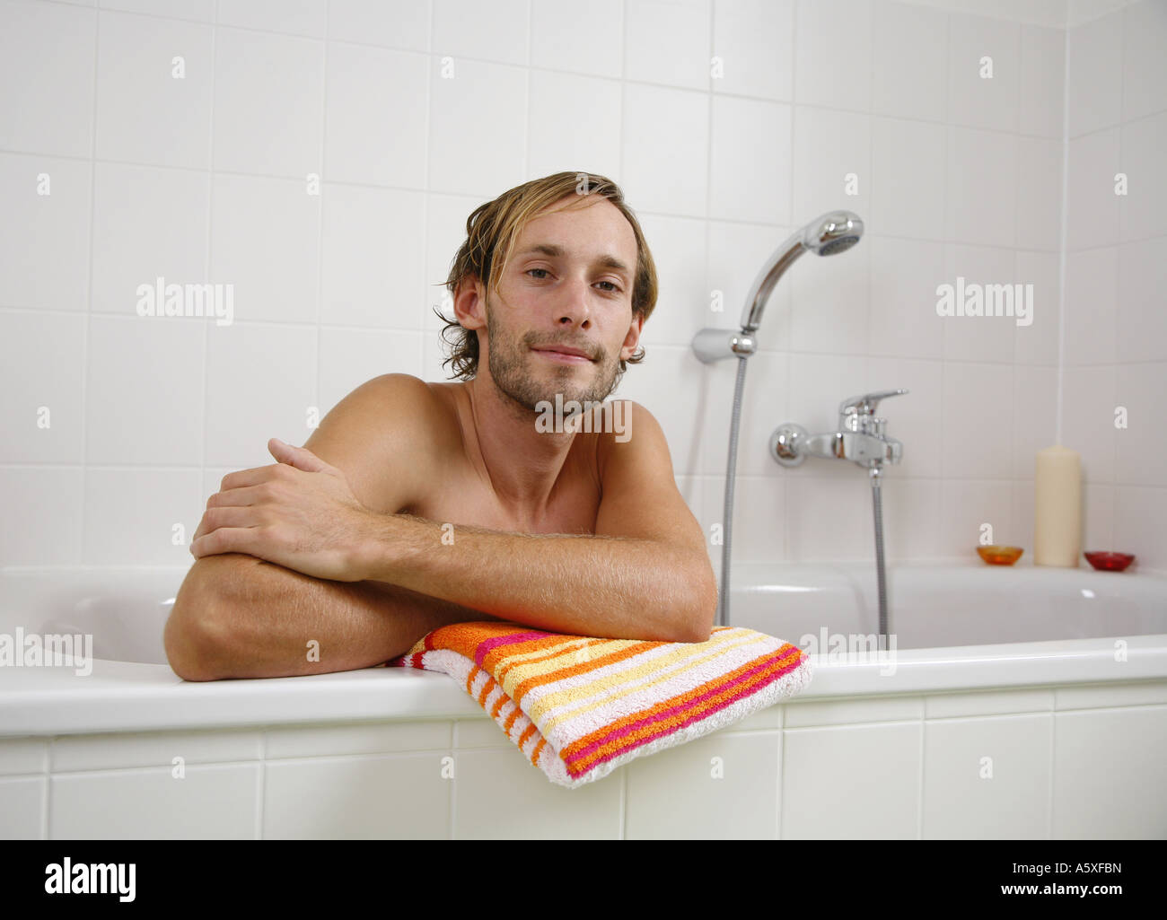 Young man in bath tub close up portrait Stock Photo - Alamy