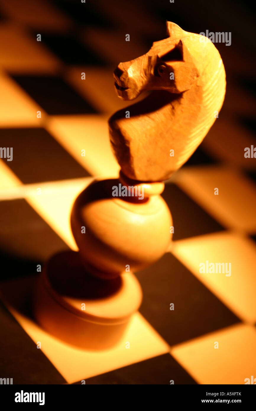Knight on chess board close up Stock Photo - Alamy