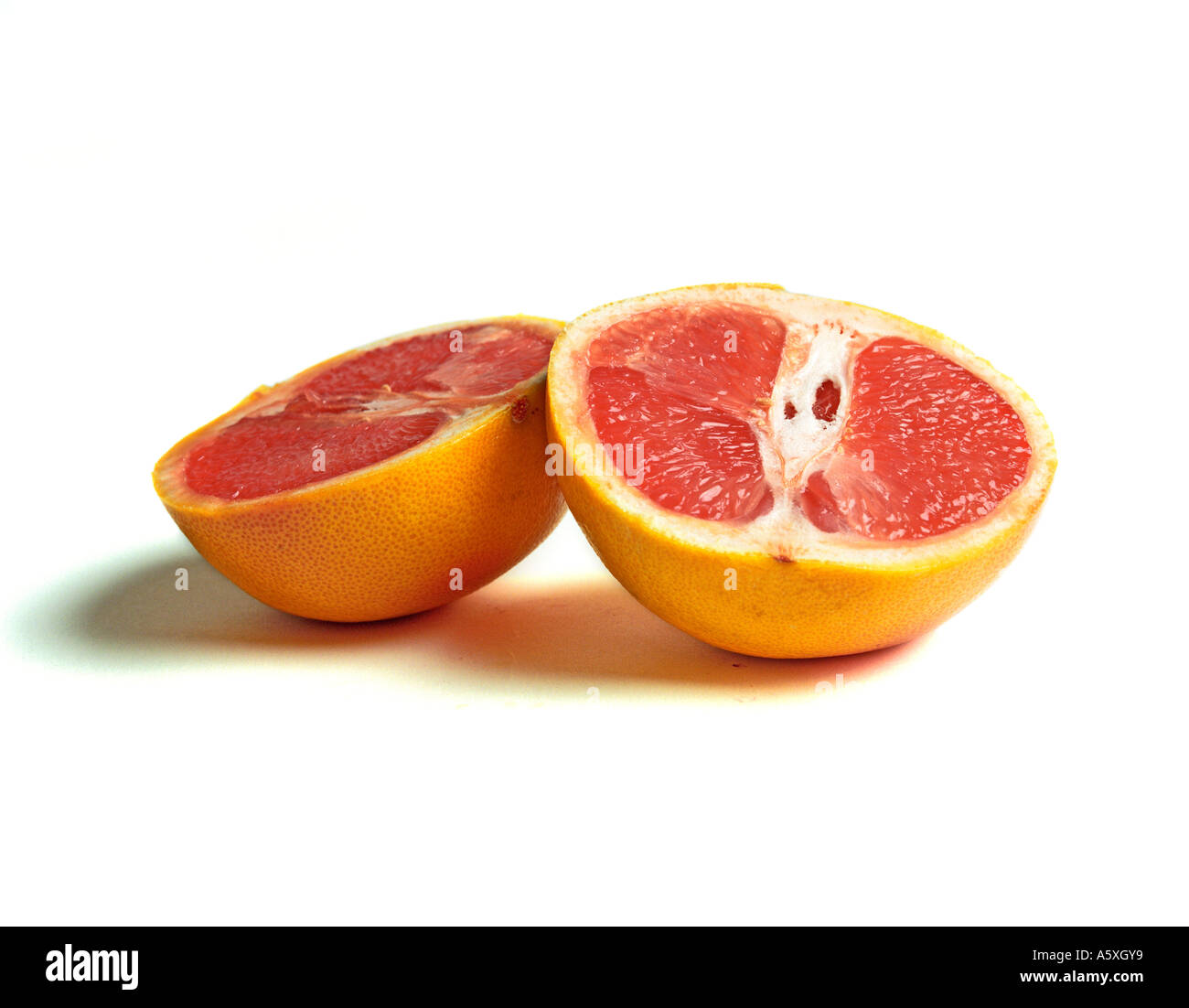Fresh grapefruit cut in Cut Out Stock Images & Pictures - Alamy
