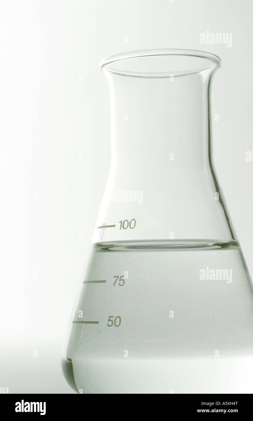 Flask containing liquid close up Stock Photo - Alamy