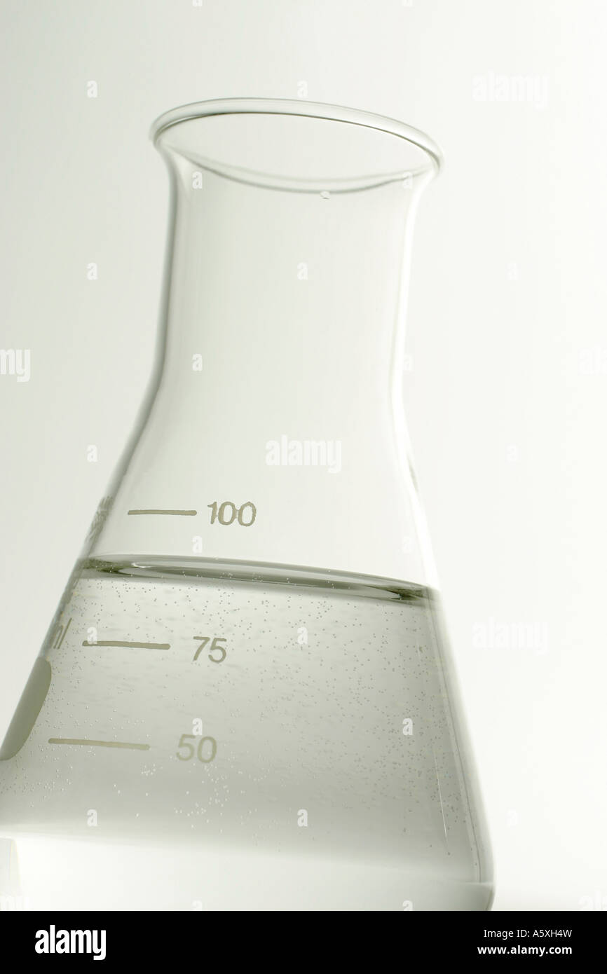 Flask containing liquid close up Stock Photo - Alamy