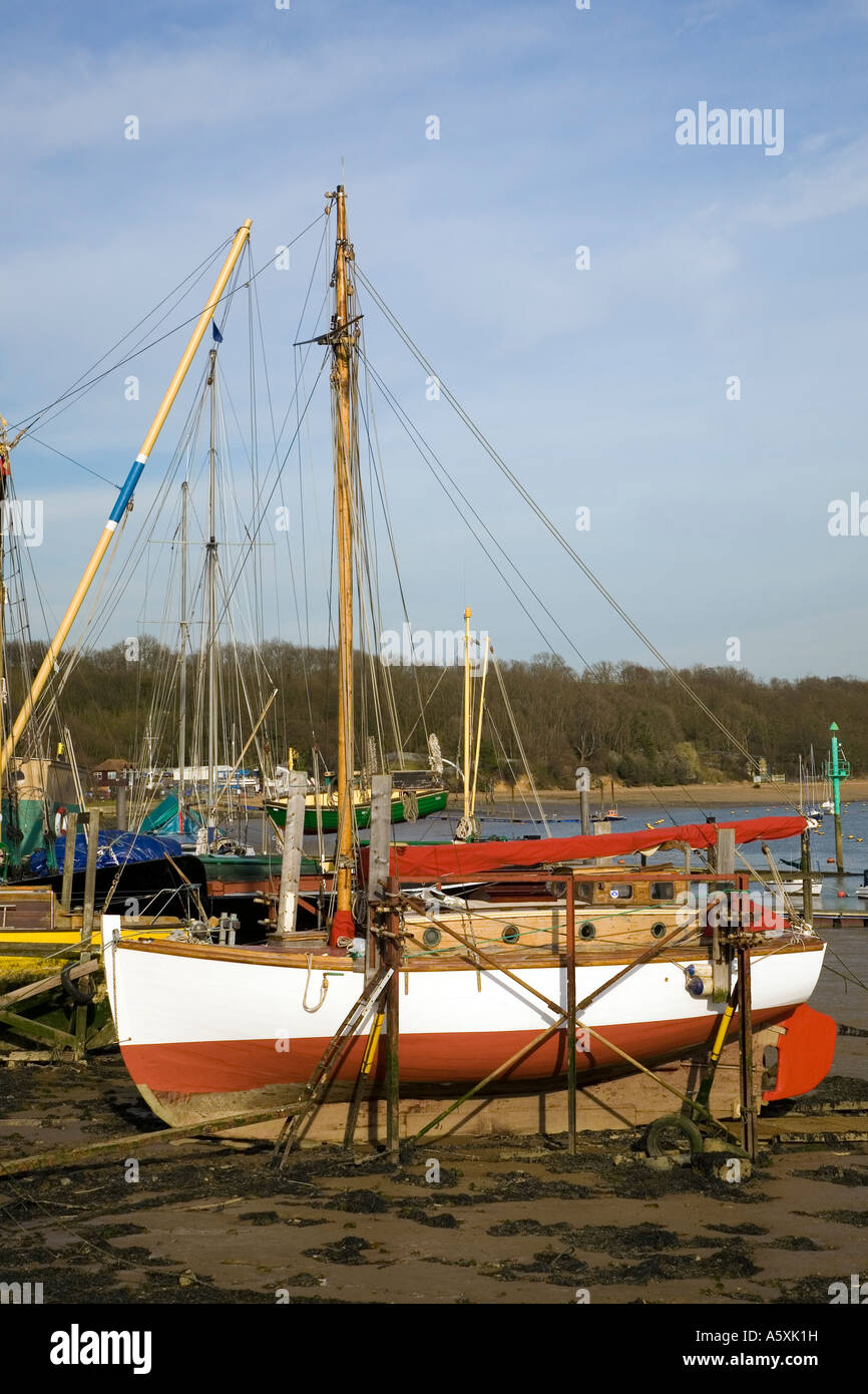 Classic old wooden sailing boat moored on the river Medway at Upnor ...