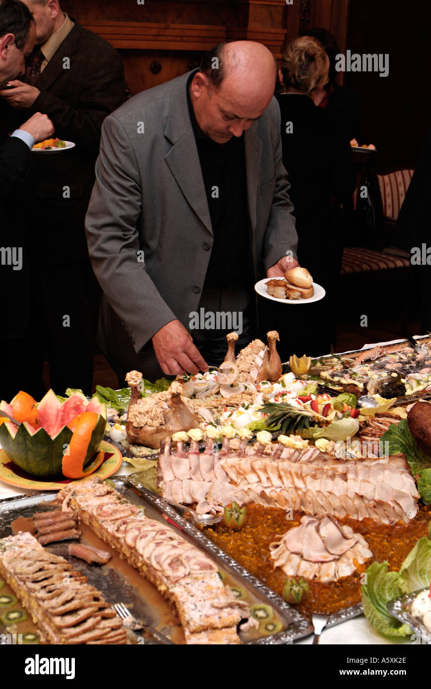 Man buffet eating food spread hi-res stock photography and images - Alamy