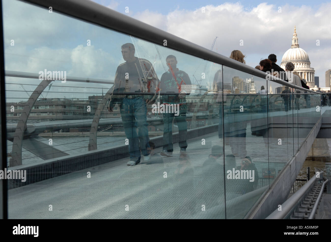 People Crossing the Millenium Bridge Stock Photo - Alamy