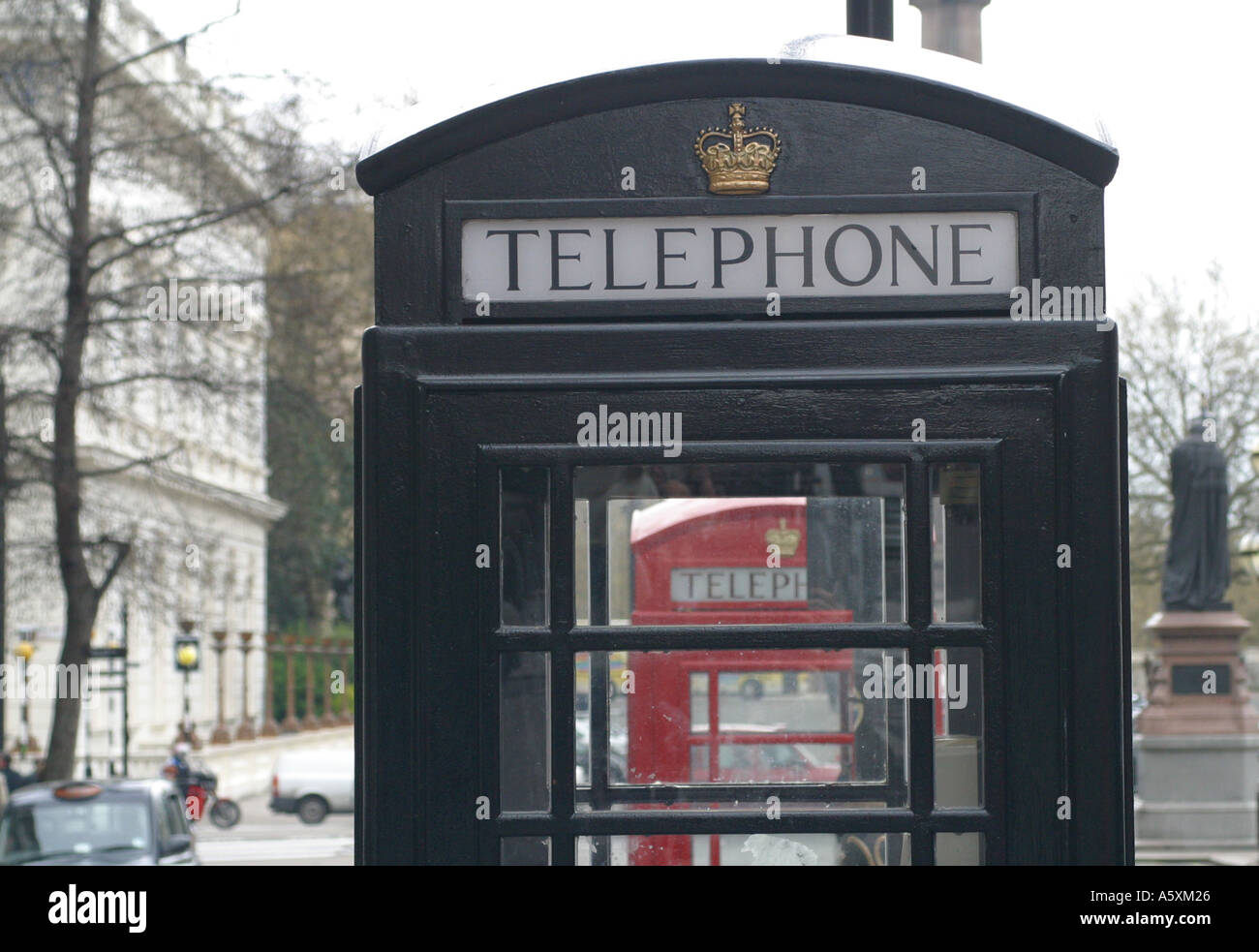 black old fashioned telephone box in london Stock Photo - Alamy