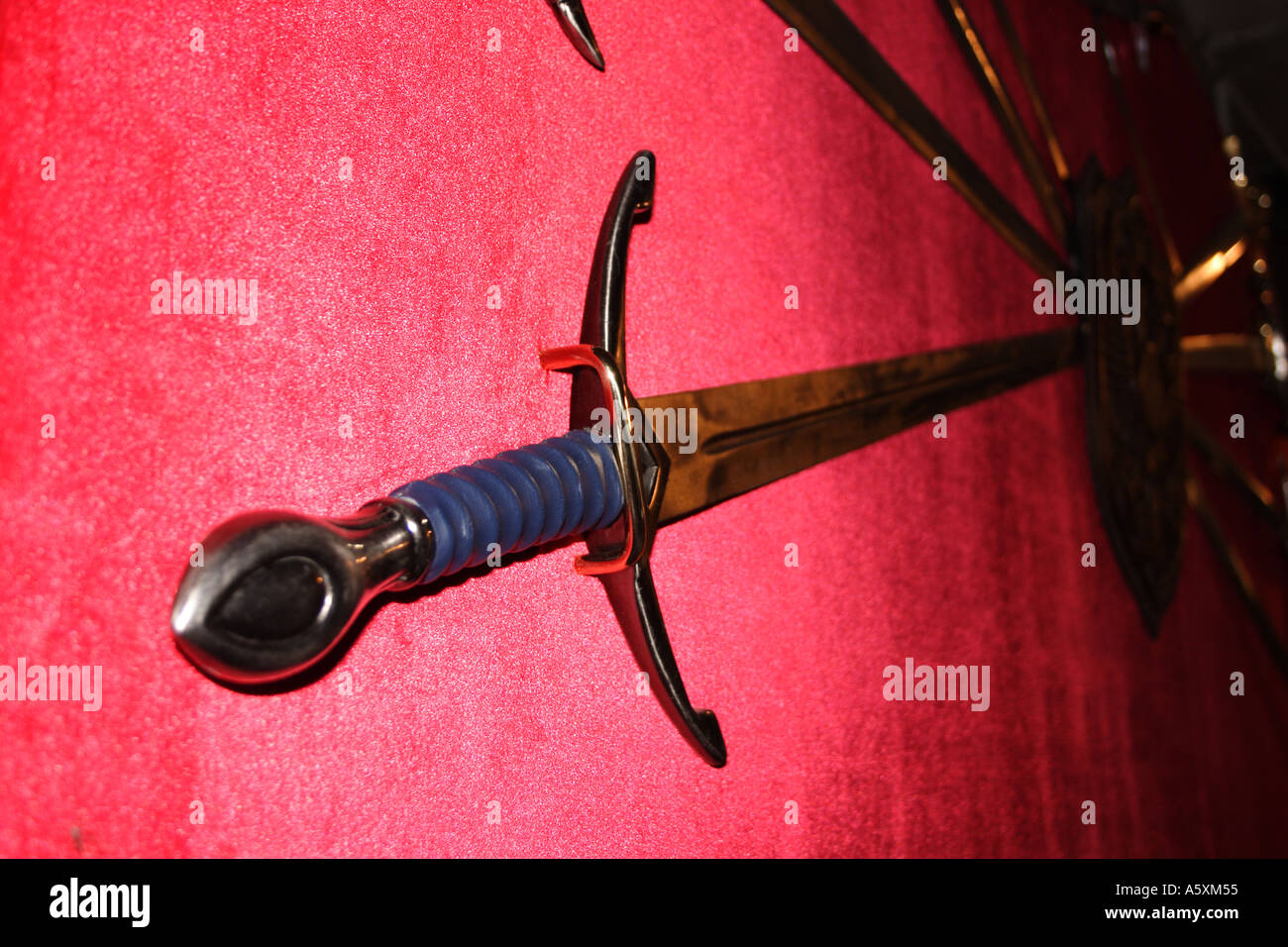 A MEDIEVAL CASTLE CONTAINING SWORDS AND ARMOUR Stock Photo - Alamy