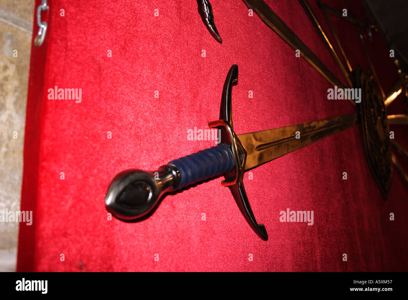 A MEDIEVAL CASTLE CONTAINING SWORDS AND ARMOUR Stock Photo - Alamy