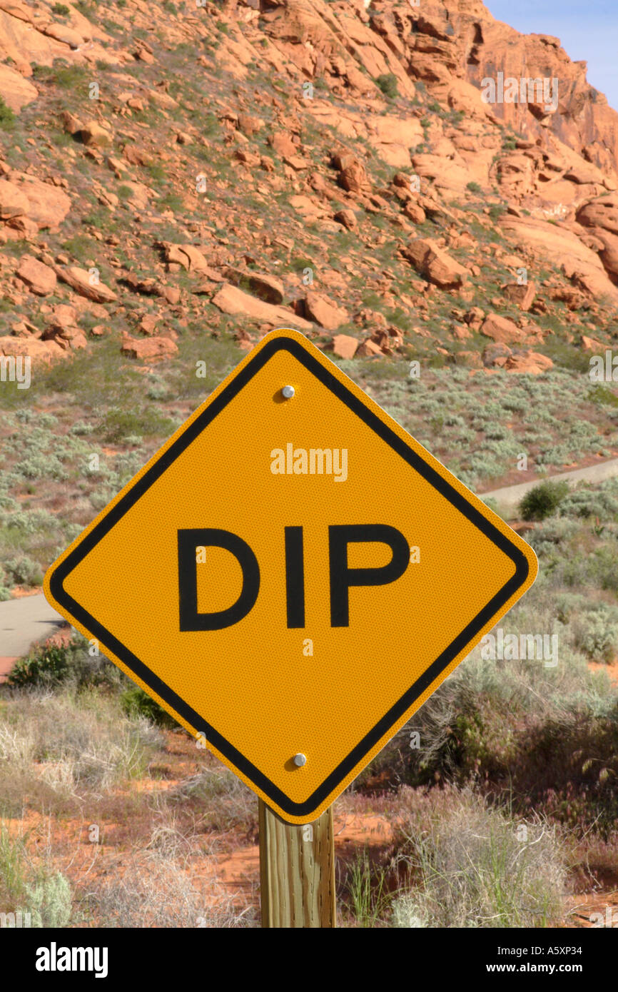 diamond shaped road sign warning of dip in road Stock Photo - Alamy