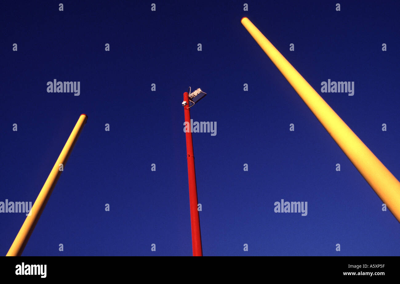 TWO YELLOW AND ONE RED POLE POINTING SKYWARD Stock Photo - Alamy
