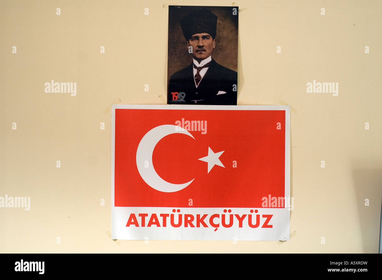 Portrait of Mustafa Kemal Ataturk above a Turkish flag, in a small ...
