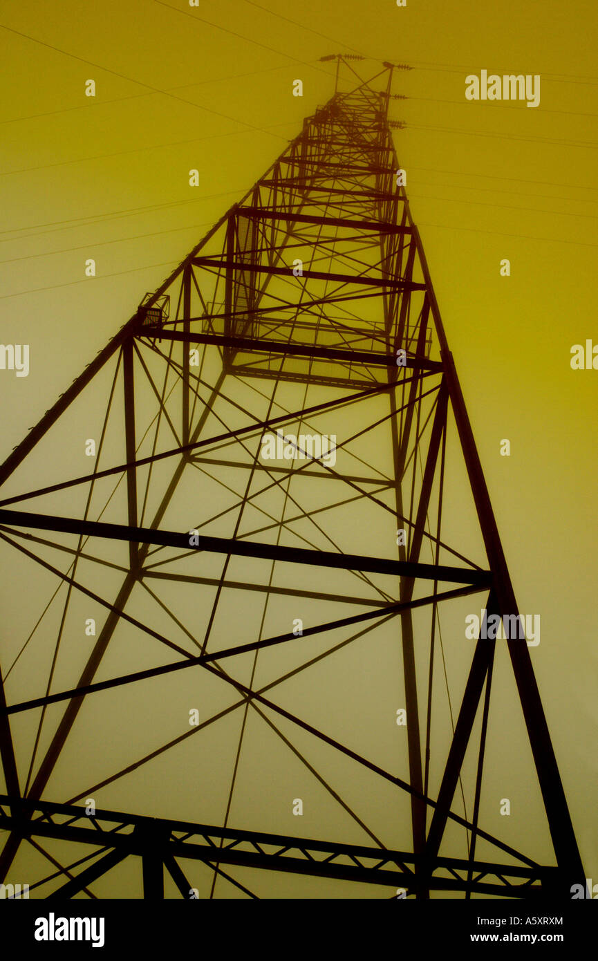 electrical transmission tower reaches up into the fog Stock Photo - Alamy