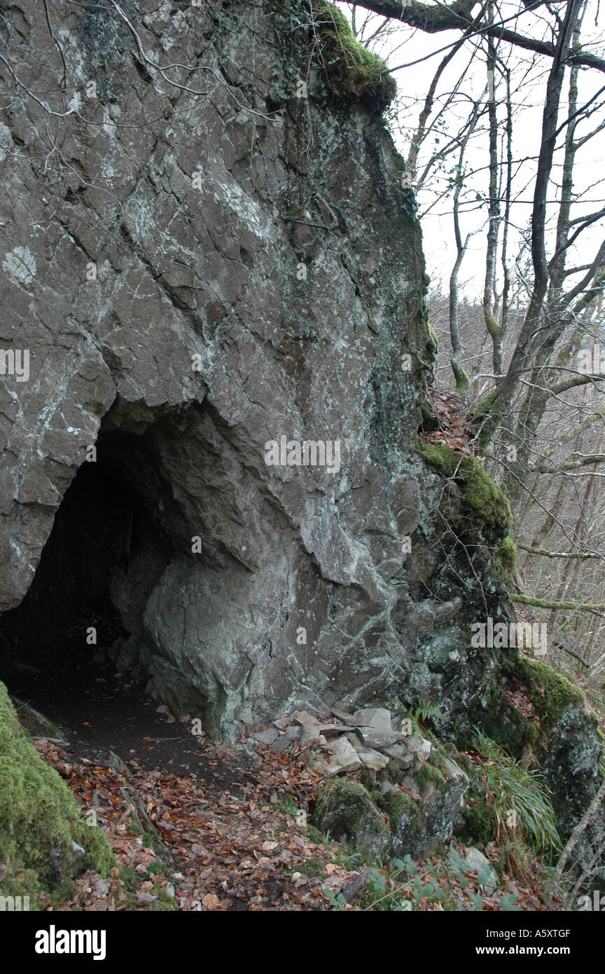 Entrance to cave on woodland walk Stock Photo - Alamy