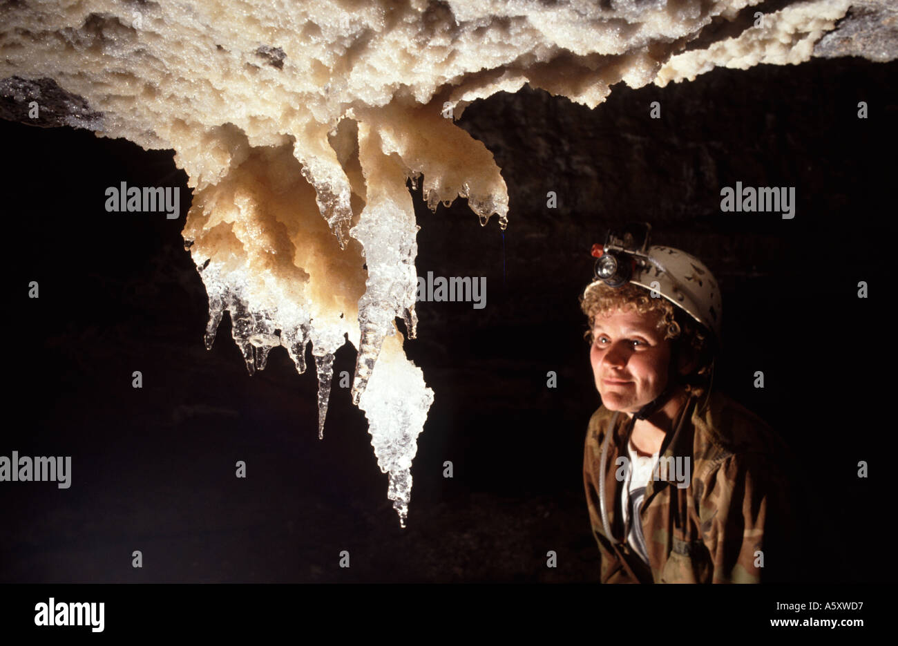 A caver with an epsomite formation at The North Pole Ellisons Cave ...
