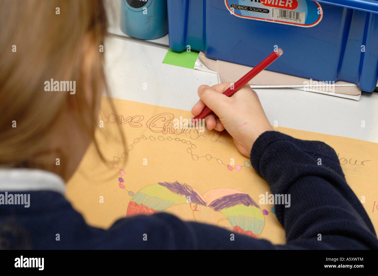 Pupil at work in the classroom Stock Photo - Alamy