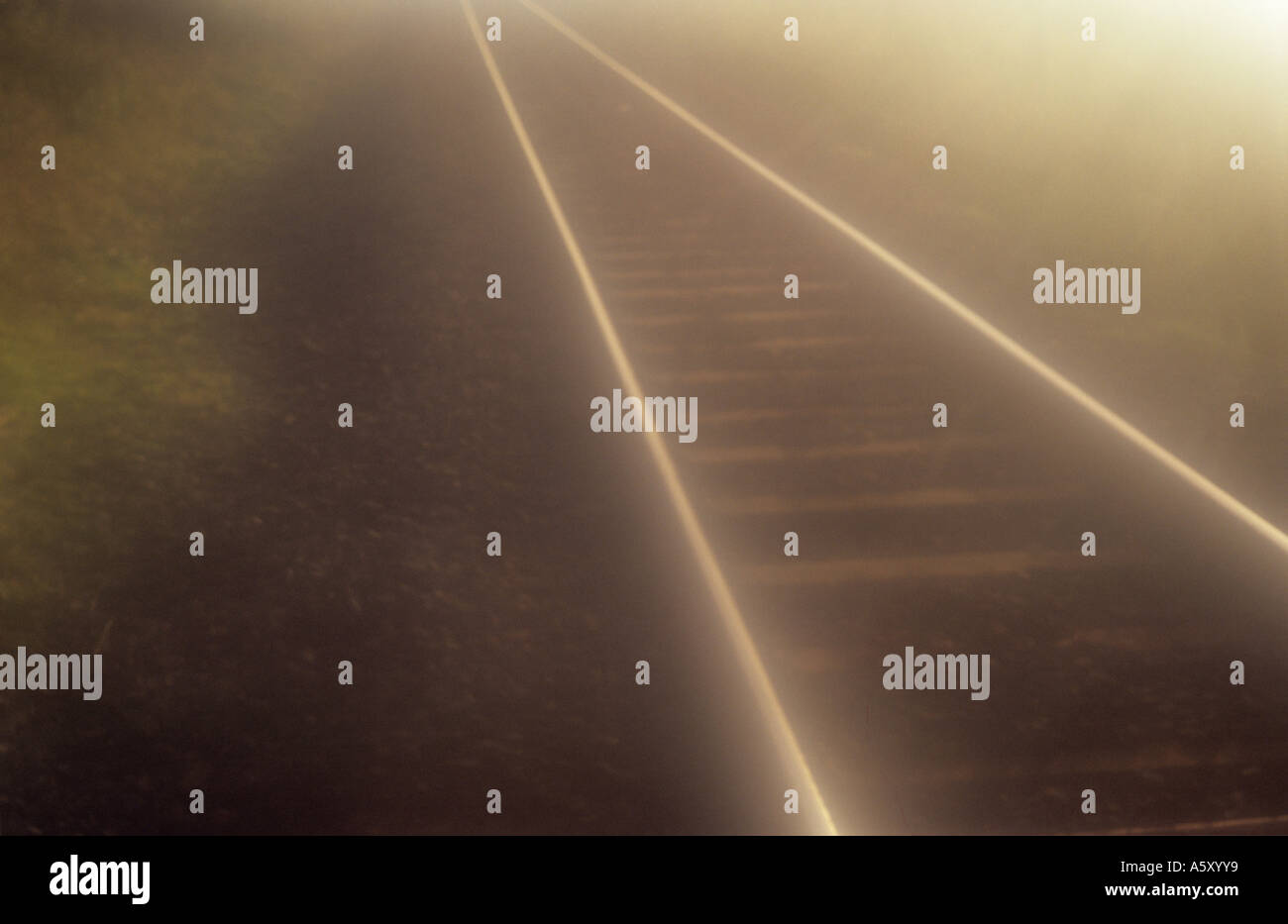 Atmospheric view of railway tracks converging into the distance in a ...