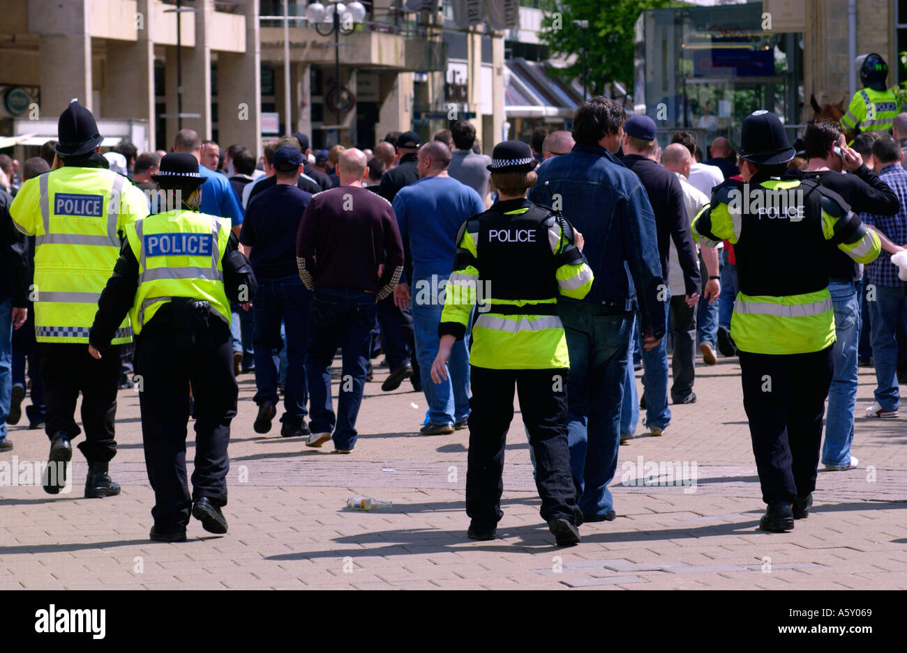 Crowd walking street police officer hi-res stock photography and images ...