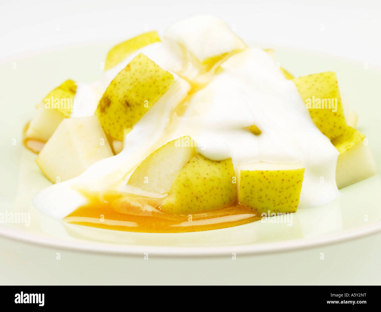 Chopped Pears with Yoghurt and Honey Stock Photo - Alamy