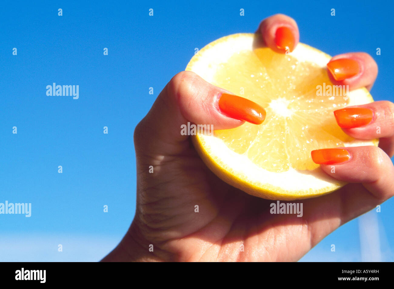 Hand crushing fruit hi-res stock photography and images - Alamy
