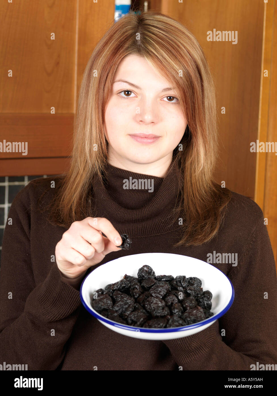 Woman Eating Prunes Model Released Stock Photo - Alamy