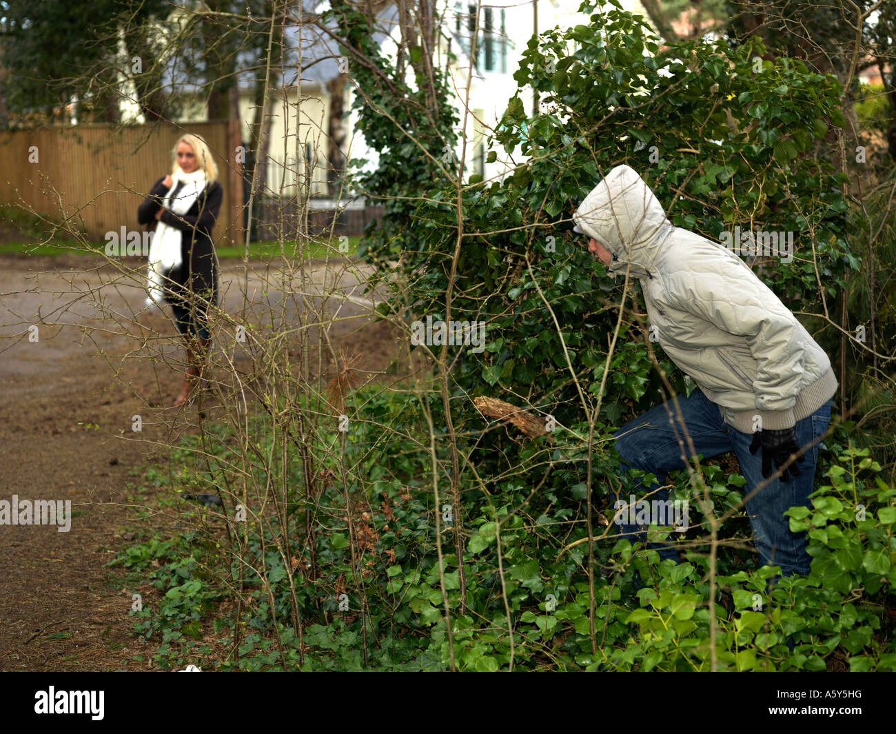 Young Woman Walking On A Quiet Public Path Being Threatened By A ...