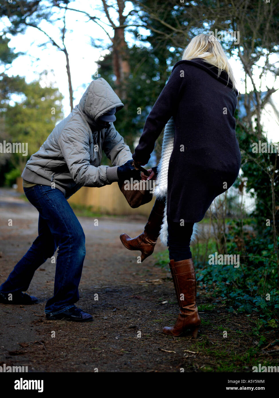 Young Woman Walking On A Quiet Public Path Being Threatened By A ...
