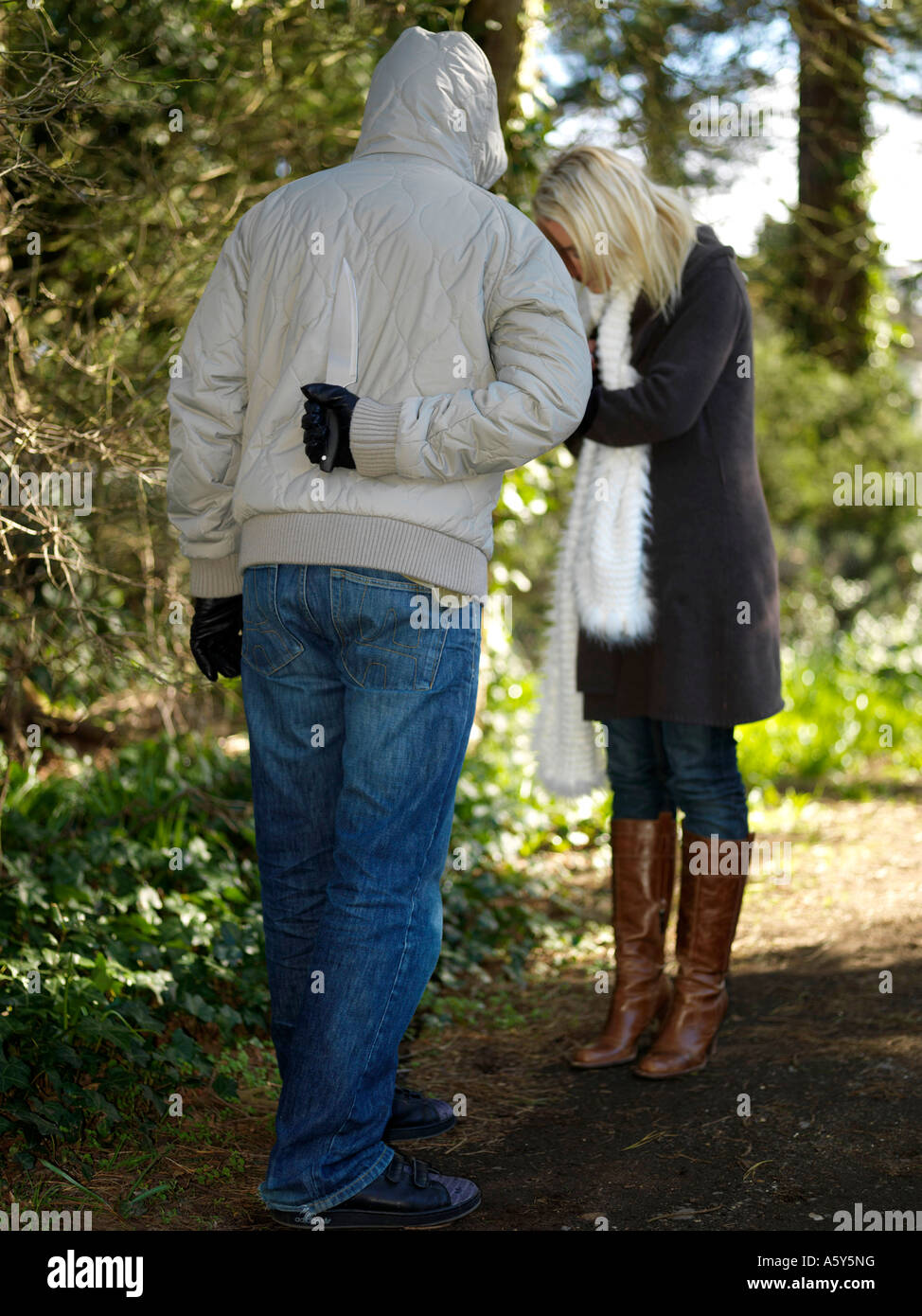 Young Woman Walking On A Quiet Public Path Being Threatened By A ...