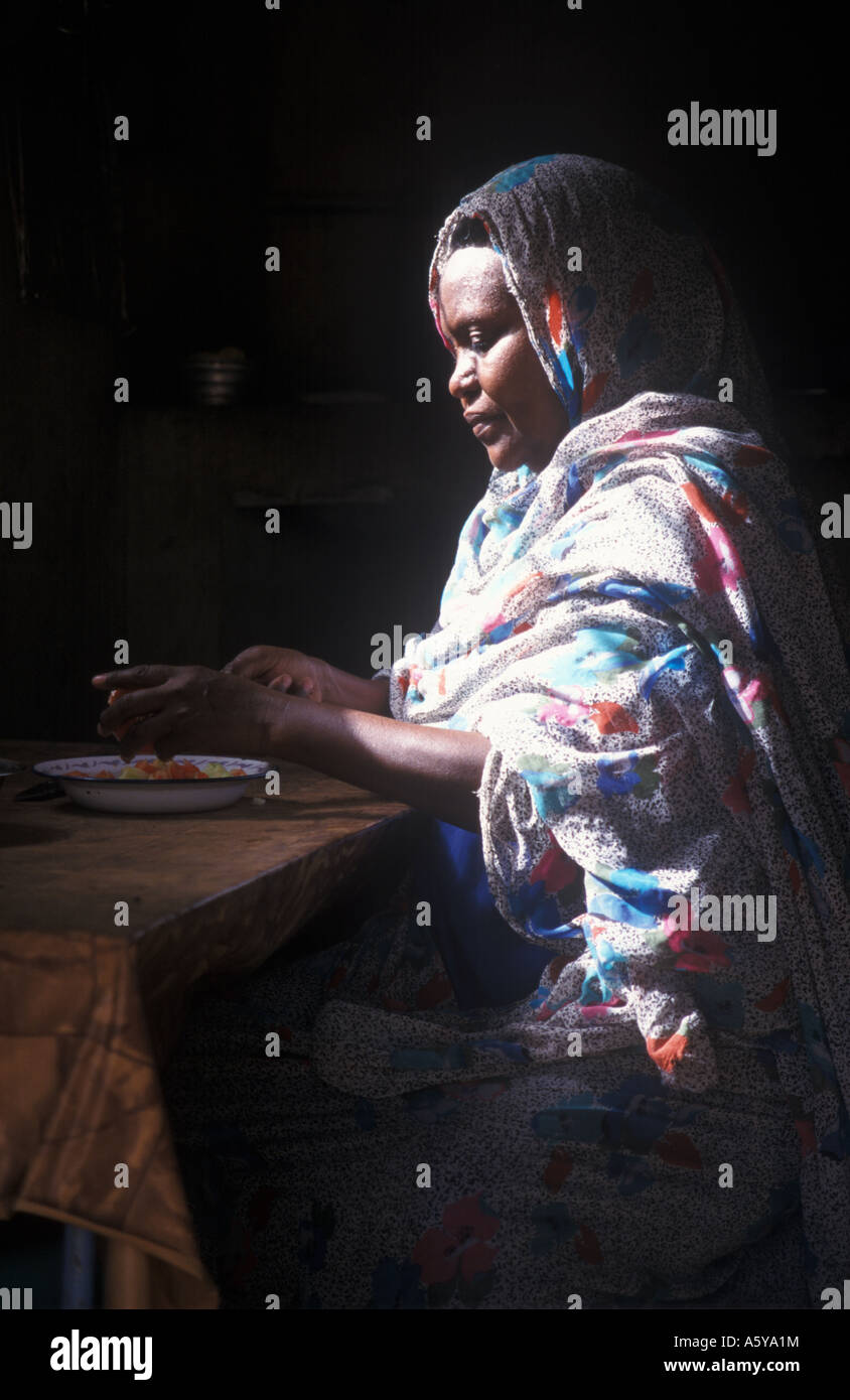 Sudanese woman in the kitchen wearing the traditional dress called Tob ...