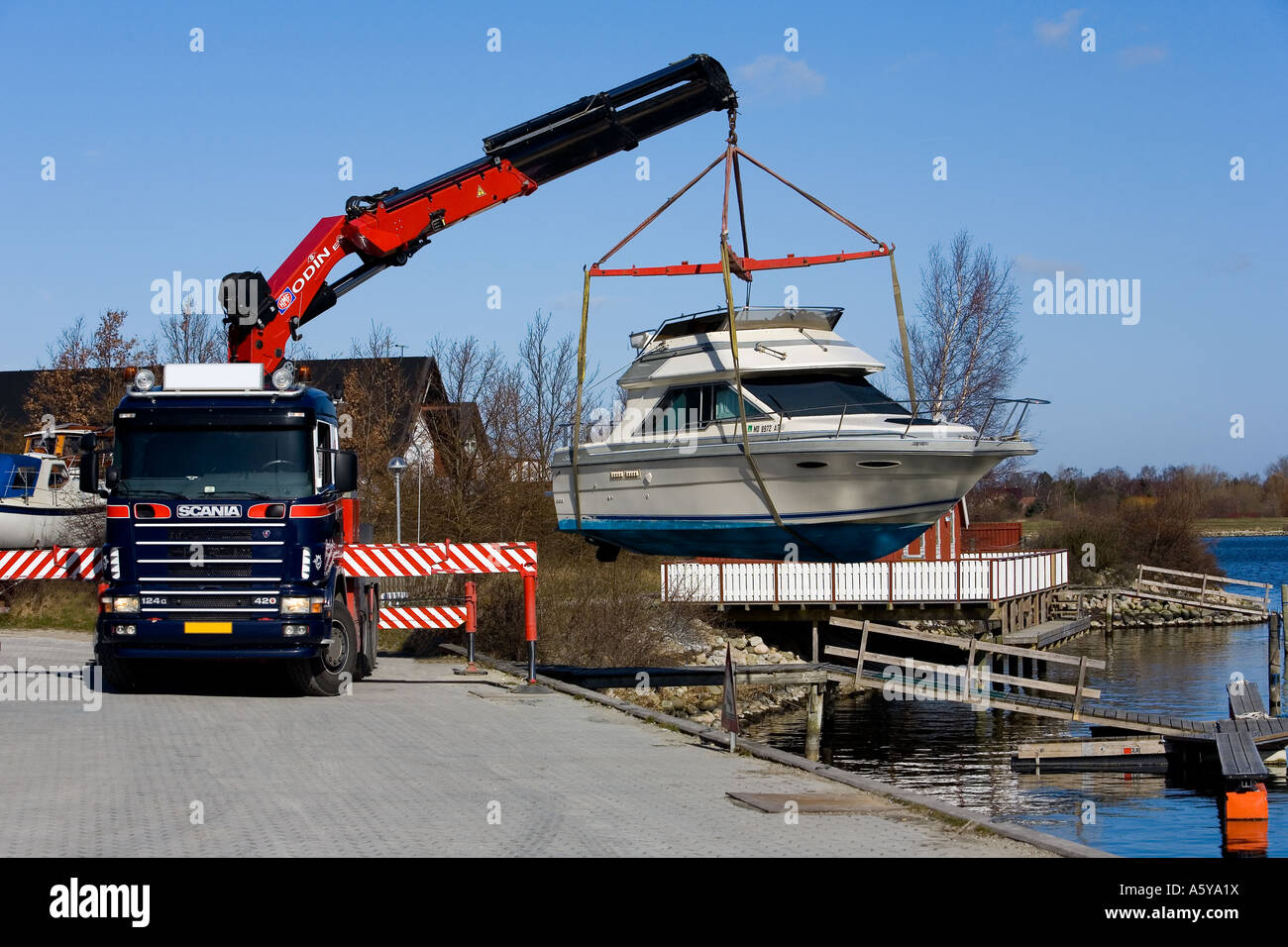 A motor cruiser launched into the water Stock Photo - Alamy