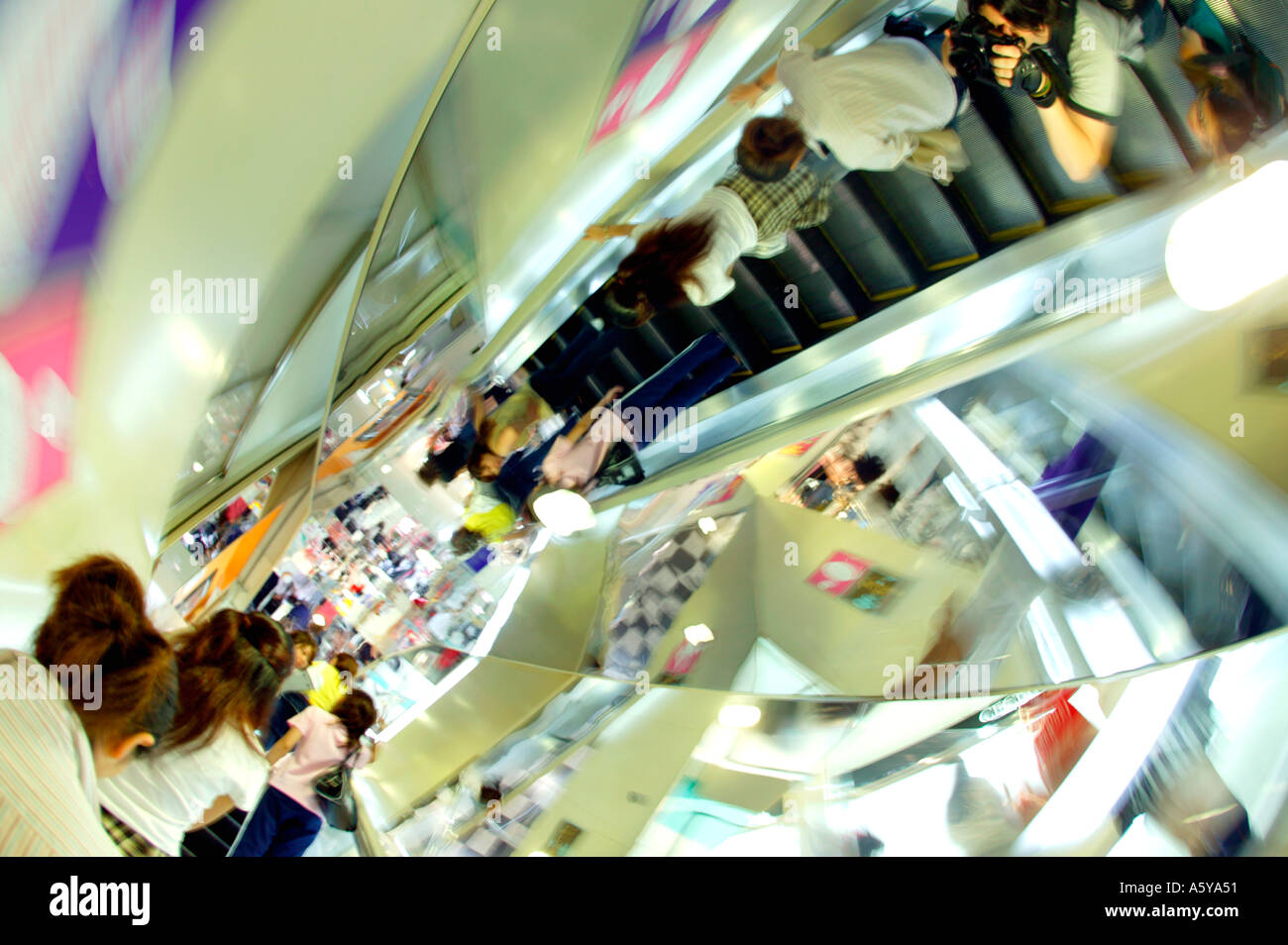 escalator reflection from a ceiling mirror in Tokyo Japan Stock Photo ...