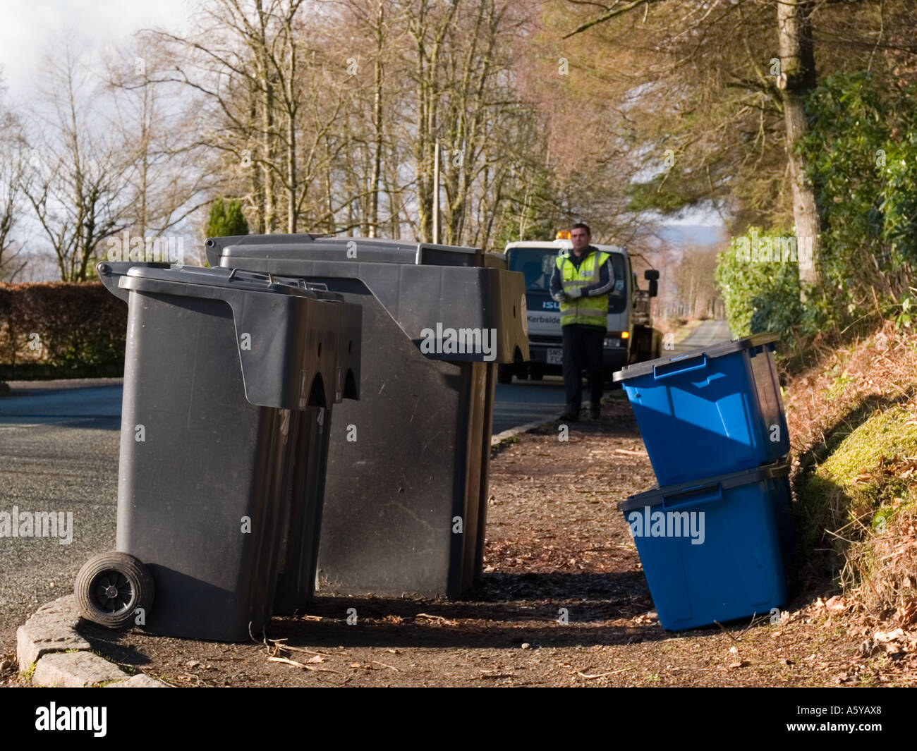 Kerbside re-cycling boxes beside 2 wheelie bins on roadside. Scotland ...