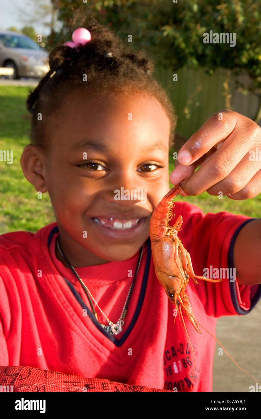 African american girl eating crawfish in New Orleans, Louisiana Stock ...