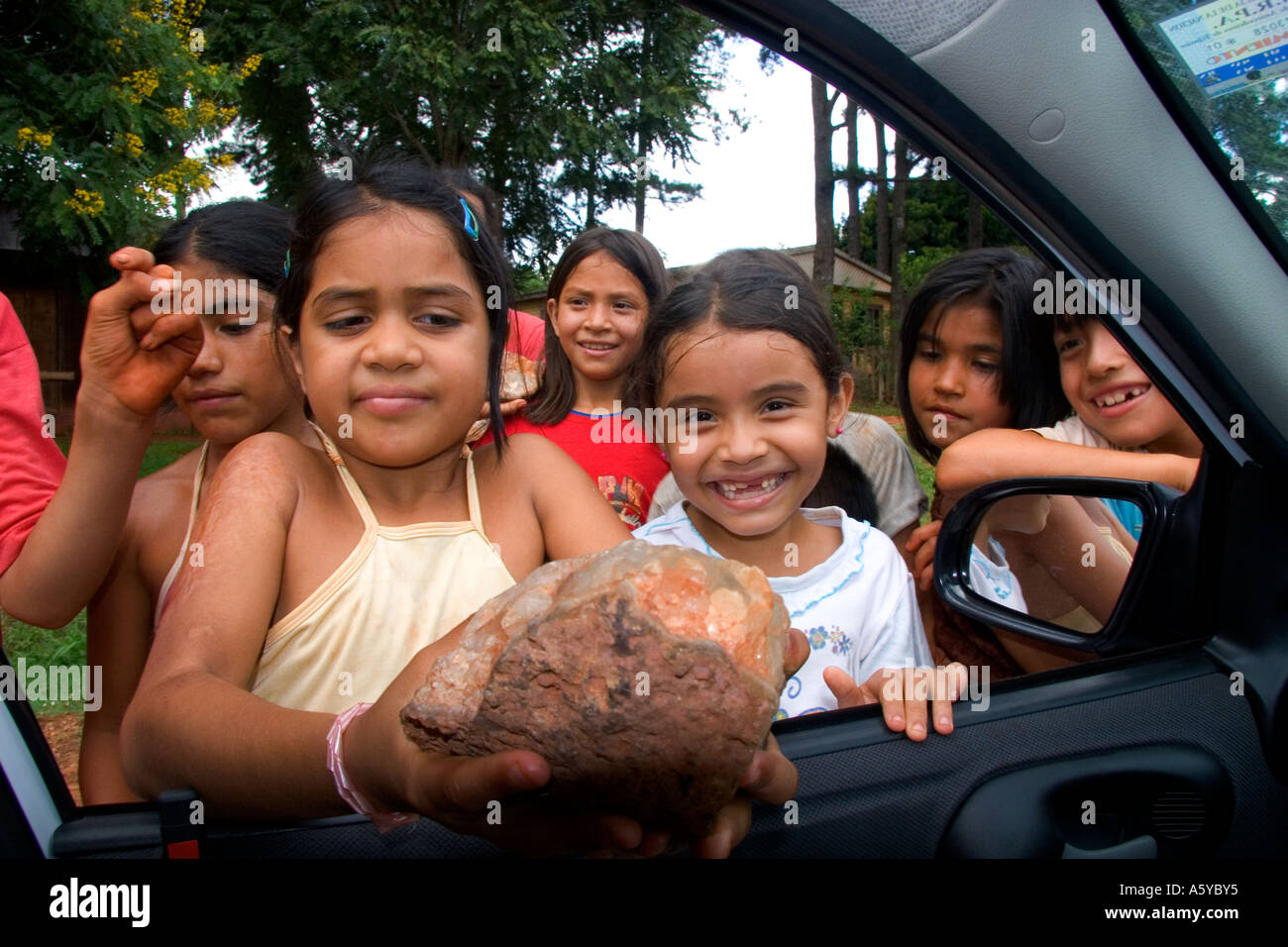 Children selling crystals and gemstones outside a mine in Libertad ...