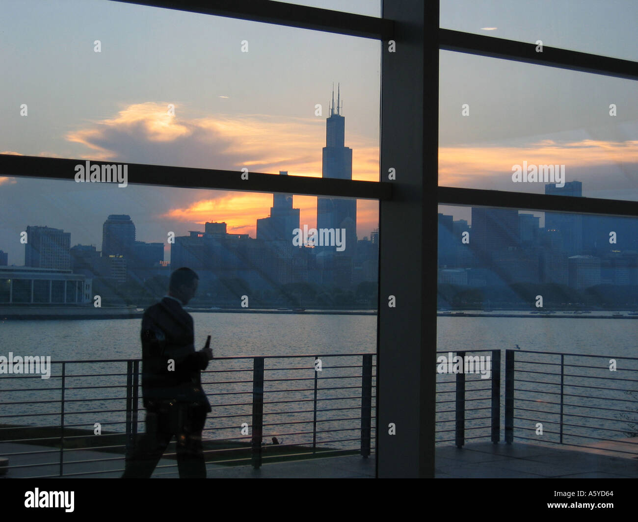 View of Chicago skyline at sunset through window of Adler Planetarium ...