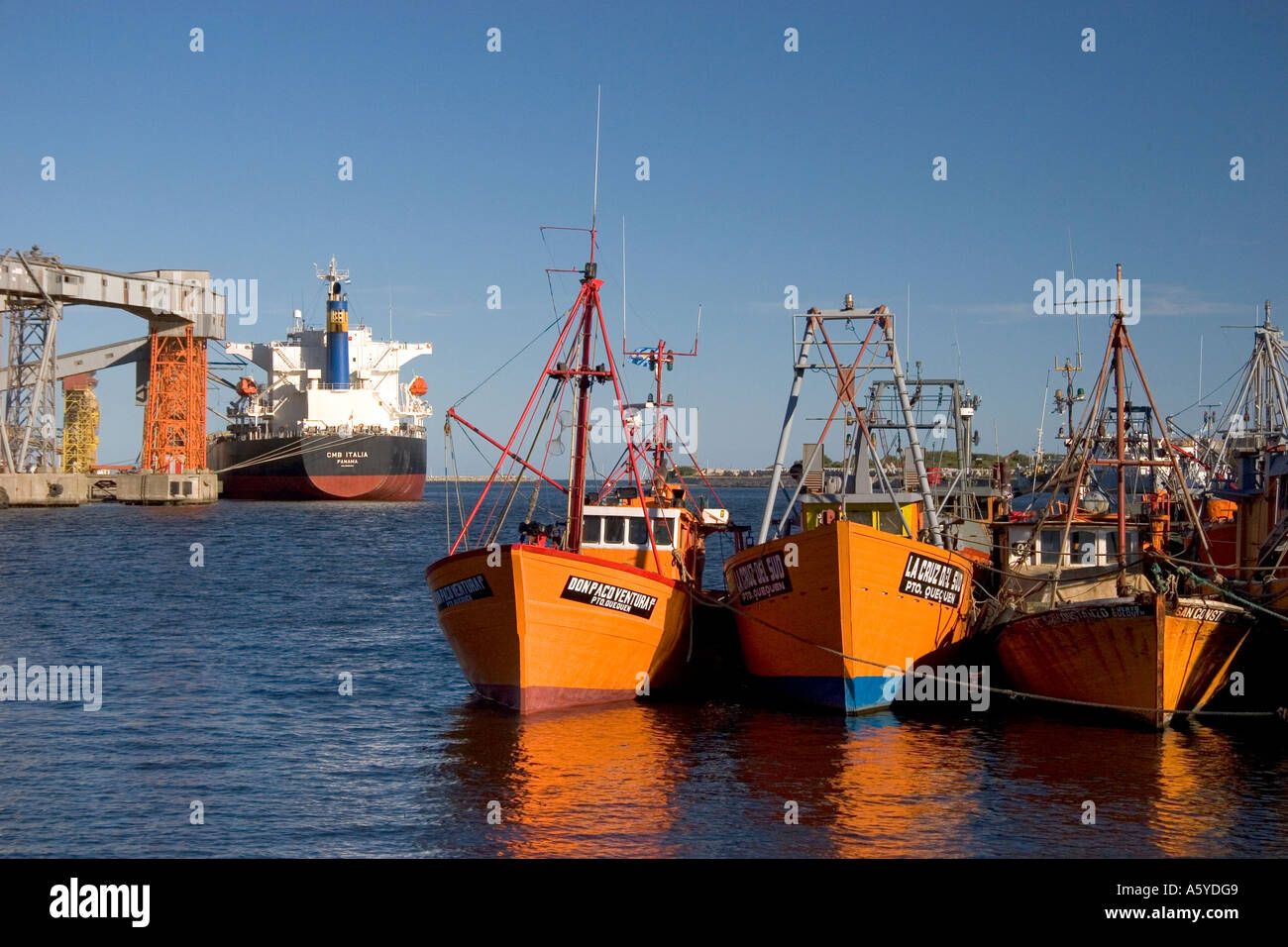 Fishing boats and grain ship at Necochea, Argentina Stock Photo - Alamy