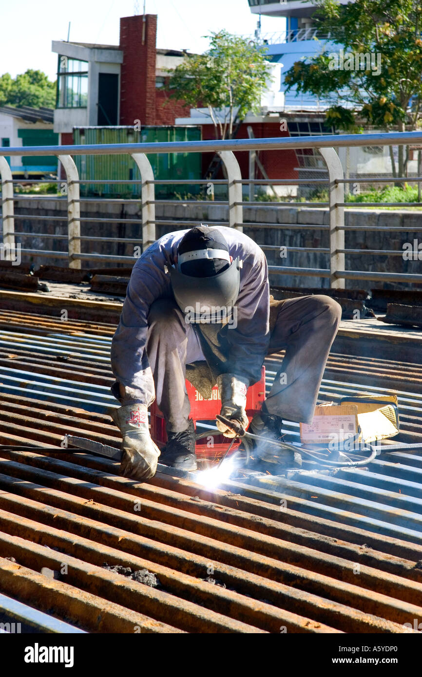 Construction worker welding on bridge deck in Buenos Aires, Argentina ...