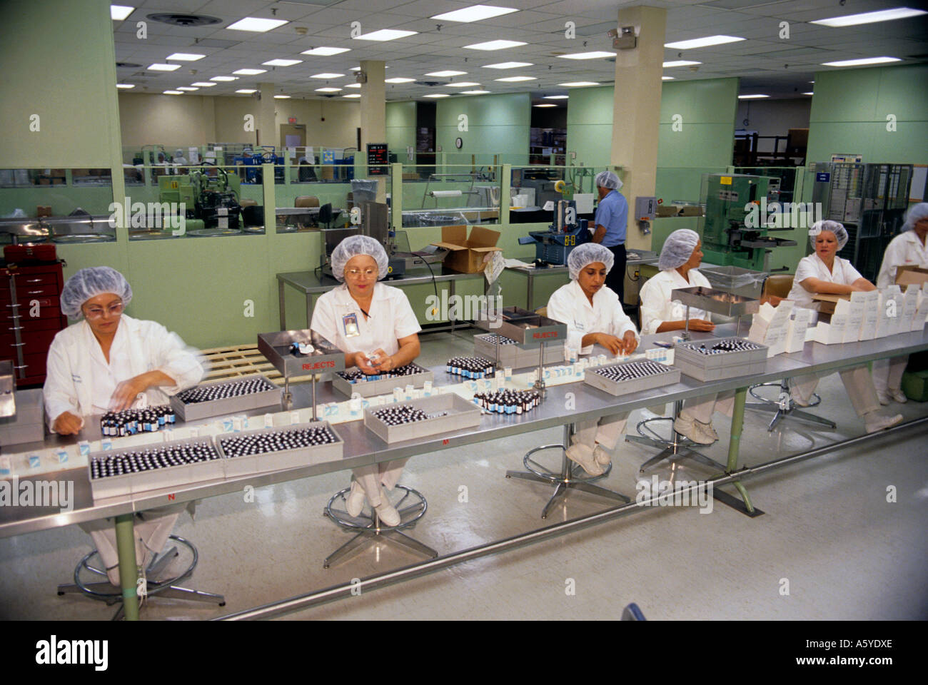 Workers packaging bottles at a pharmaceutical factory in Puerto Rico ...