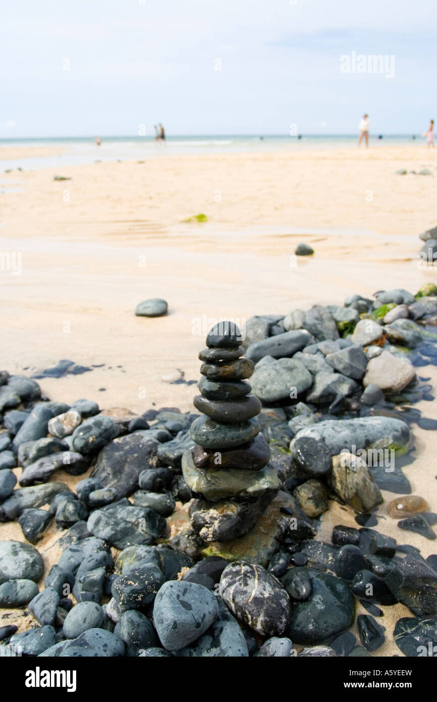 Small pile of balanced pebbles on beach Stock Photo - Alamy