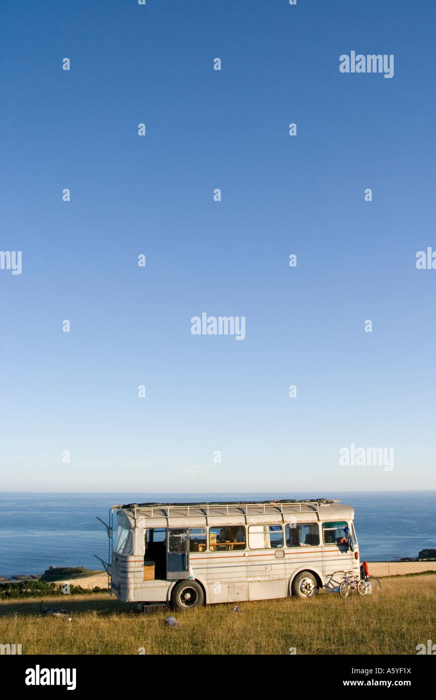 Camping Van Old bus on field in South Devon UK Stock Photo - Alamy