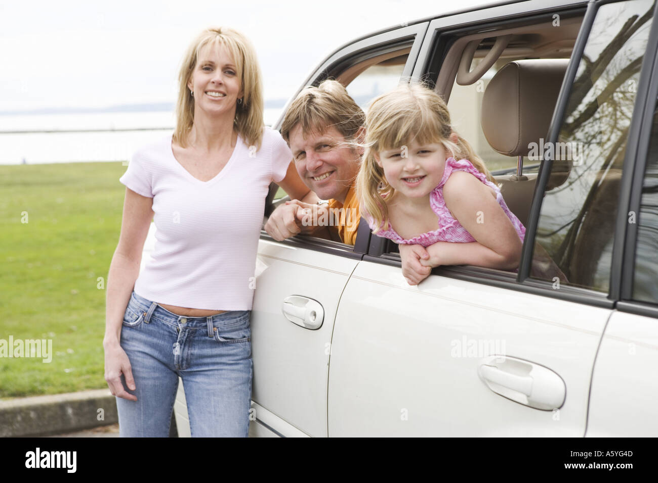 Happy family together in car Stock Photo - Alamy