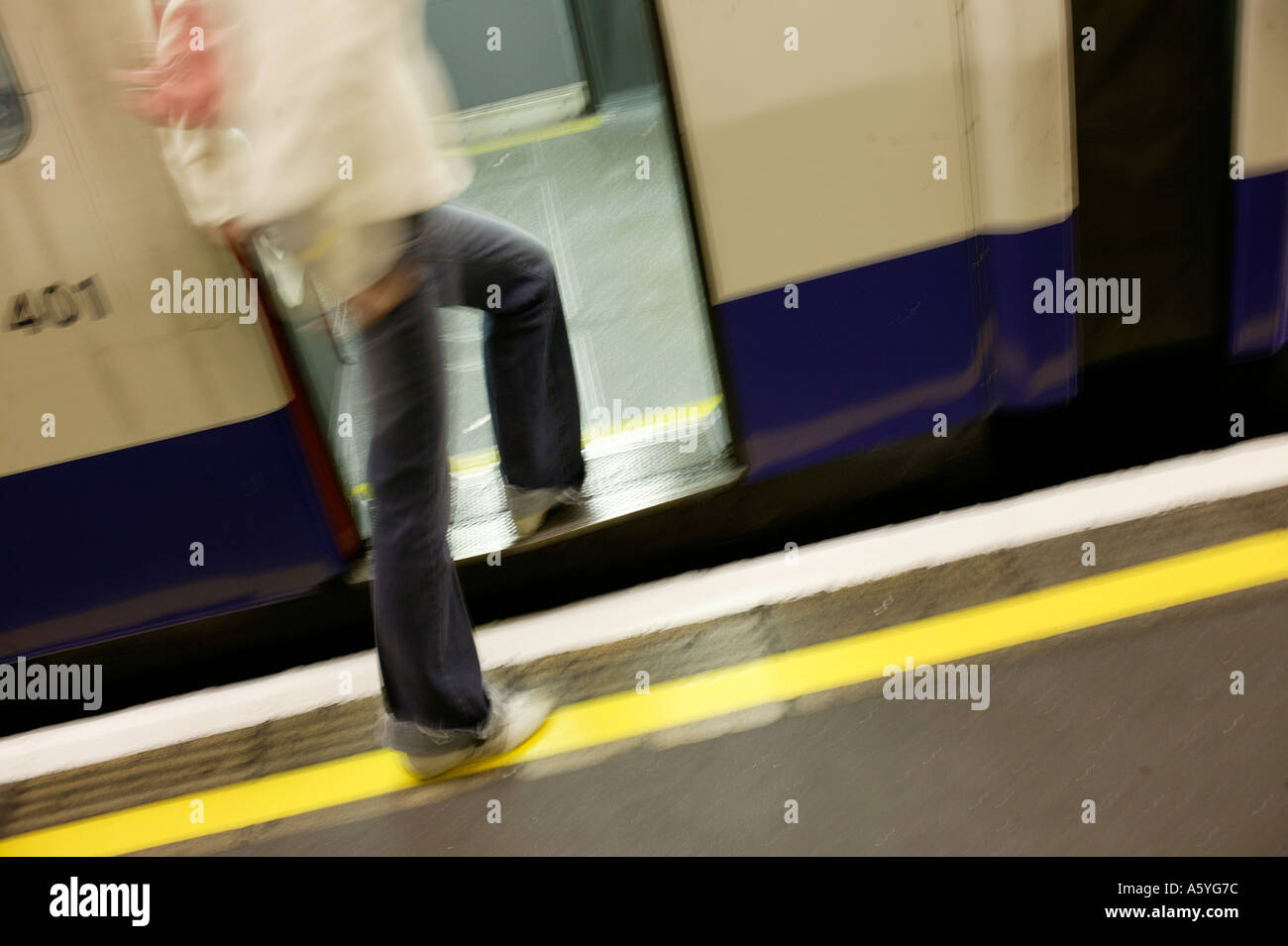 Tube passenger legs hi-res stock photography and images - Alamy