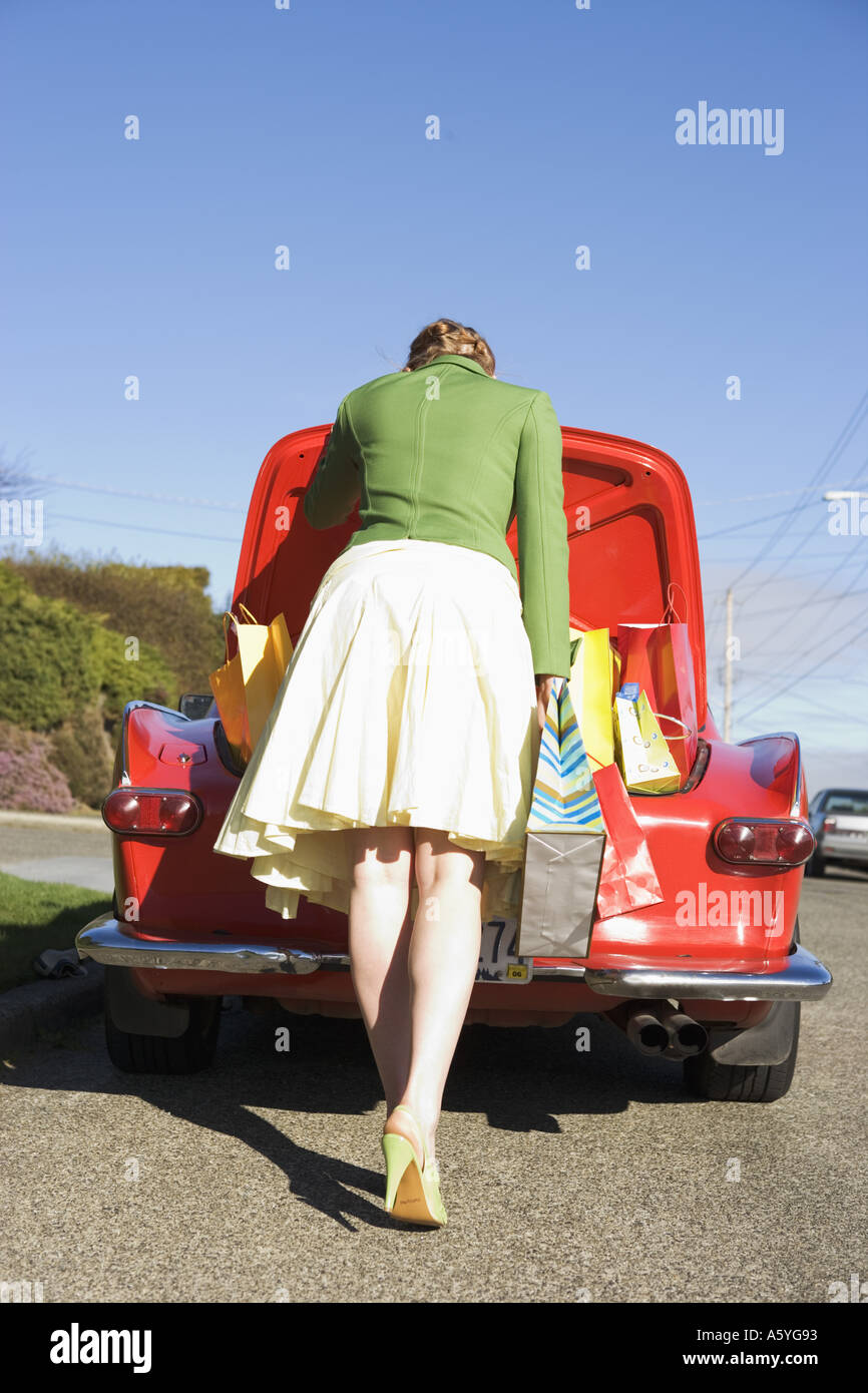 Female shopper loading car hi-res stock photography and images - Alamy