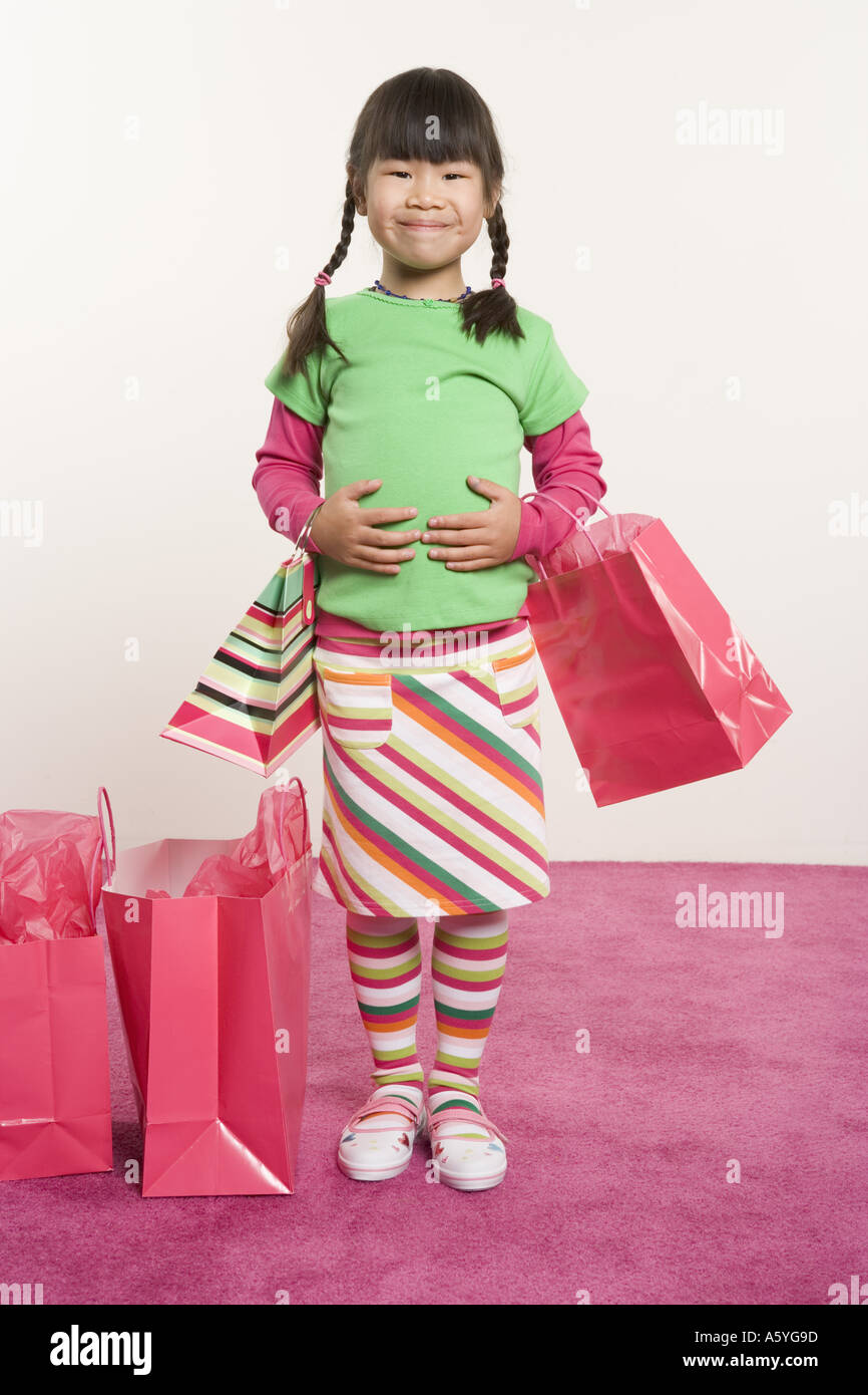 Girl holding shopping bags Stock Photo - Alamy